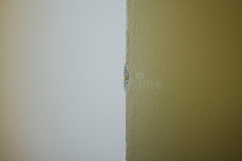 Split Corner of a Painted Wall in an Apartment with a Broken Piece ...