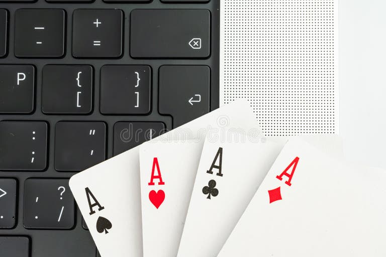 A Split Image Featuring a Laptop Showing Code and Playing Cards in a ...