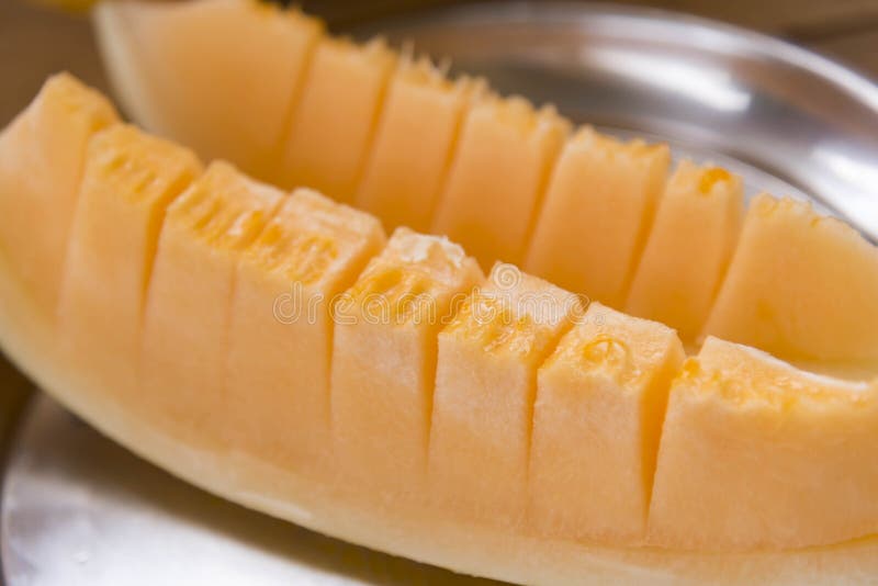 Split the Orange Melon on the Plate Stock Photo - Image of background ...