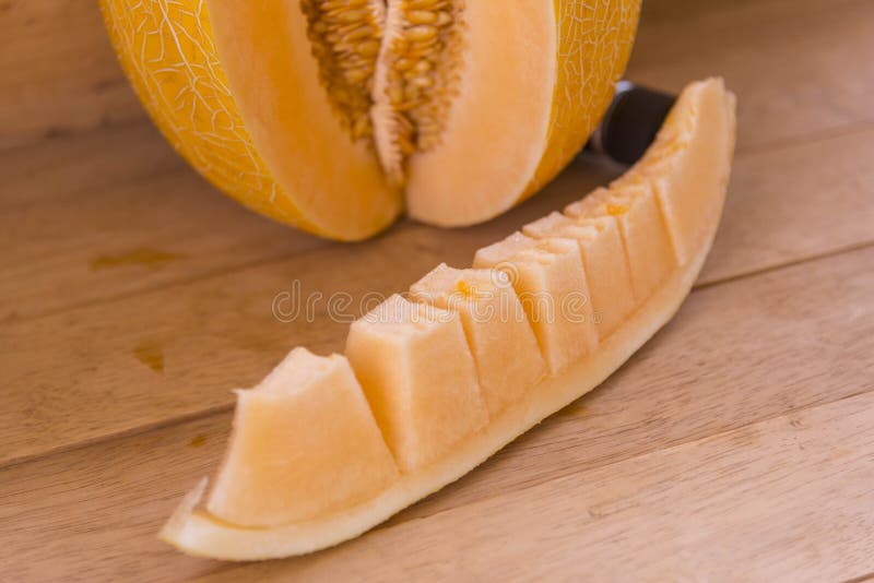 Split the Orange Melon on Wood Plate Stock Image - Image of breakfast ...