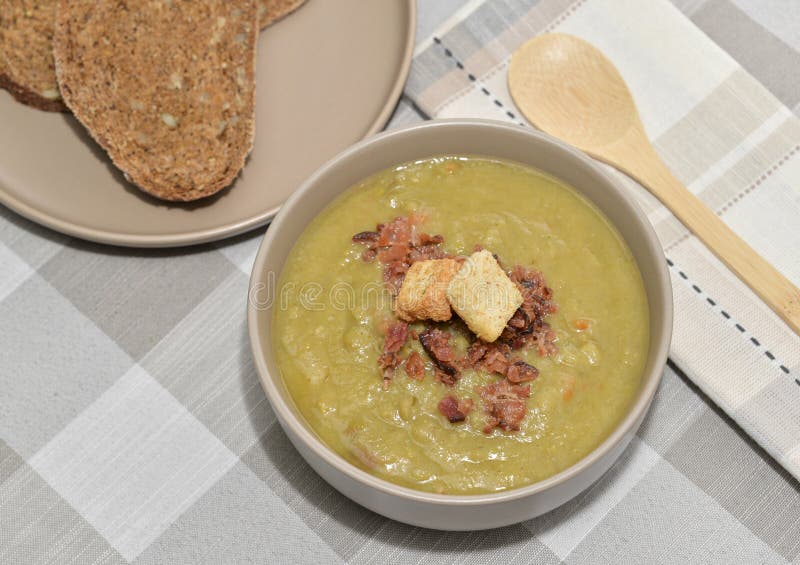 Split pea soup with bacon stock image. Image of napkin - 383125299