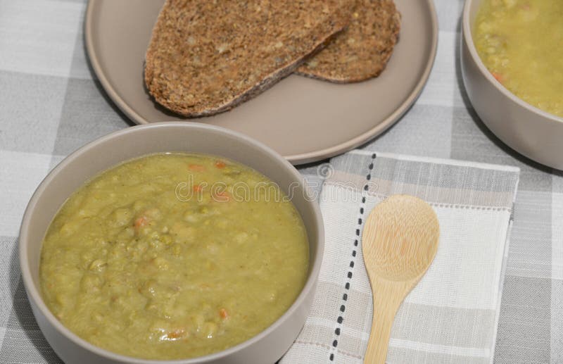 Split pea soup stock image. Image of green, bread, dish - 383125245