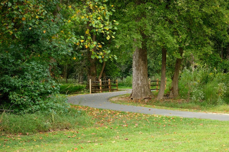 Split Rail Fence and Paved Path during Early Fall in Rock Hill, South ...