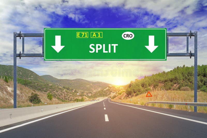 Split road sign on highway stock photo. Image of street - 102920404