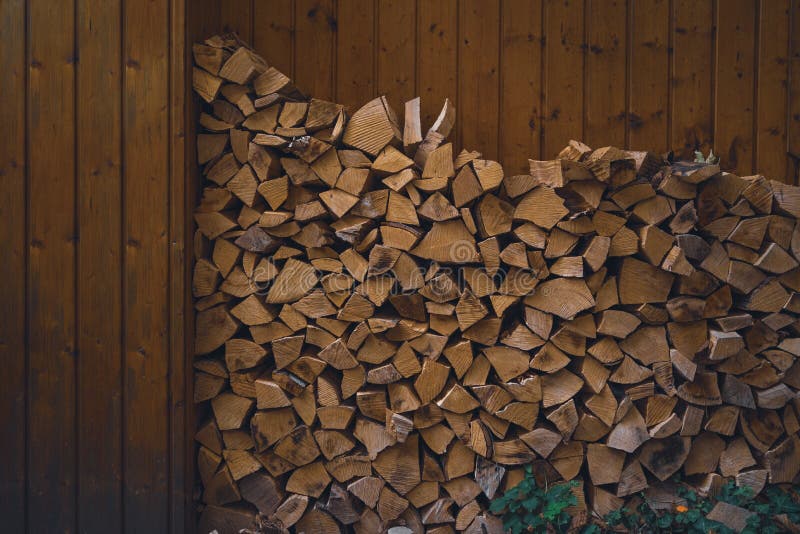 Split and Stacked Firewood on the Outside Wall of a Woodshed Stock ...