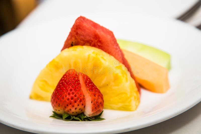 Split Strawberry and Sliced Pineapple Stock Image - Image of green ...