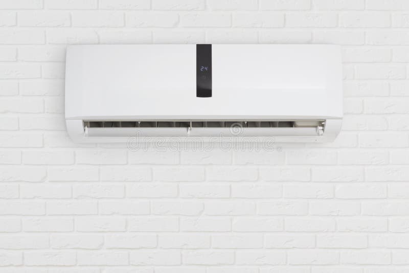 Split System Air Conditioning Unit on Decorative White Brick Wall Stock ...