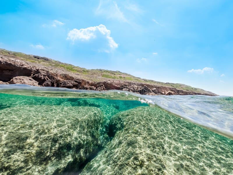 Split Underwater View of Rocks and Clear Water in Sardinia Stock Image ...