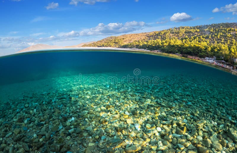Split View - Half Underwater View of Beautiful Seabed and Rocky ...