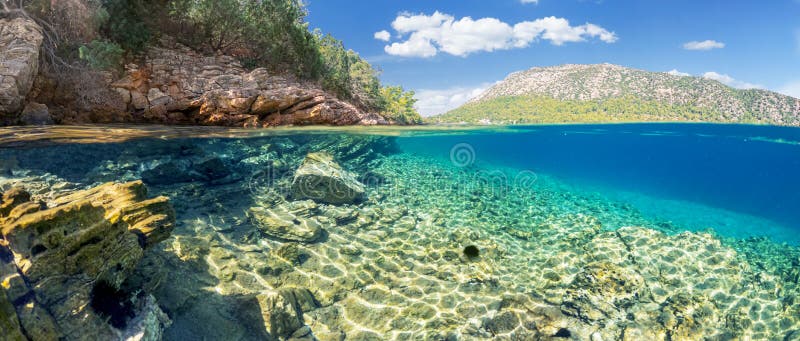 Split View - Half Underwater View of Beautiful Seabed and Rocky ...