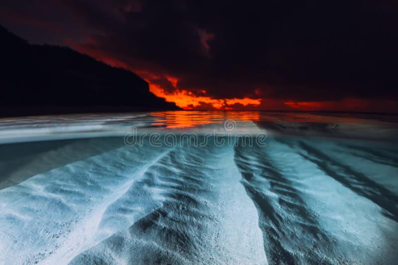 Split View with Sunset or Sunrise and Underwater Sandy Sea Bottom ...