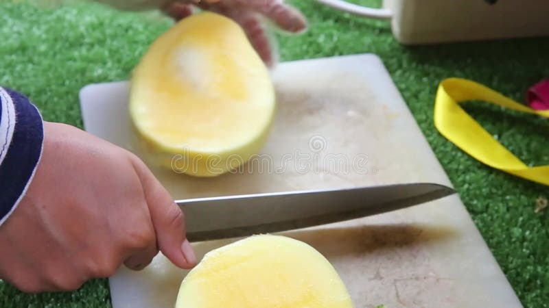 Splitting a Mango Using a Knife Close Up Stock Video - Video of slice, fruit: 312862795