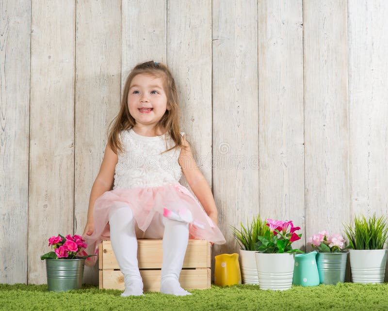 Spoiled baby in the garden stock image. Image of sunny - 87857579