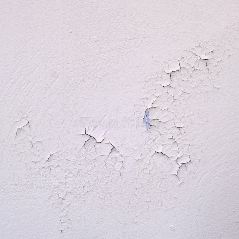 Spoiled Fresh White Paint Close-up. Cracked New Paint on a White Wall ...