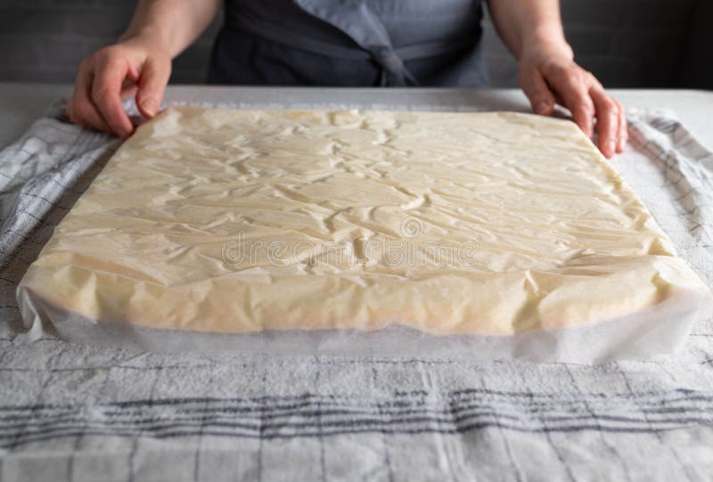 Sponge Cake Base Upside Down for Removing Baking Paper on Kitchen Table ...