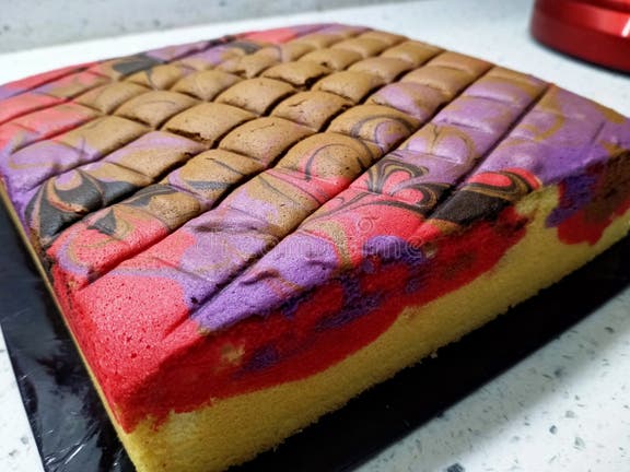 Sponge Cake with Colourful Random Patterns. Placed on a White Table ...