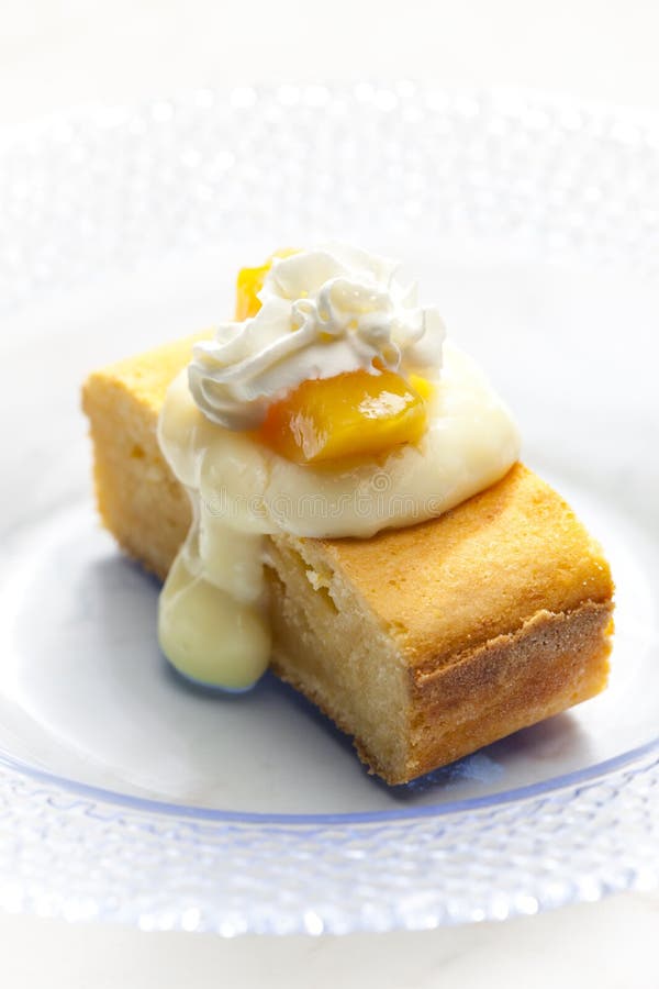 Sponge Cake with Vanilla Custard, Peach and Whipped Cream Stock Image ...