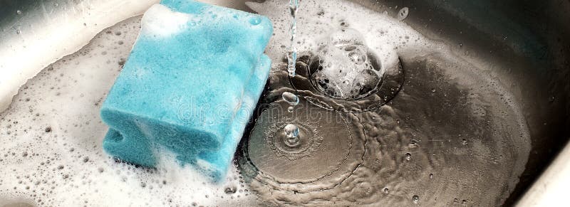 Sponge in Kitchen Sink Under Dripping Water Stock Photo - Image of ...