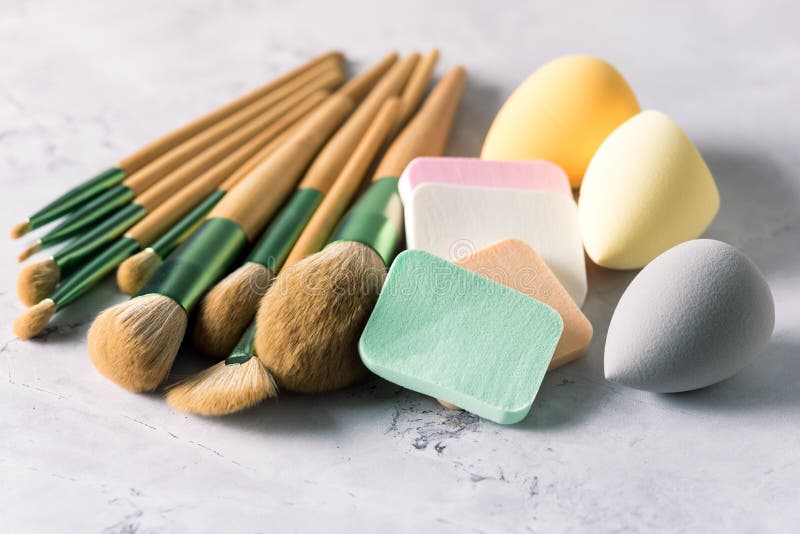 Sponge and Makeup Brushes on a Gray Background Make Up Concept ...