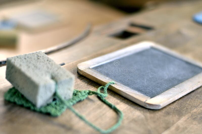 Chalkboard and Sponge Lie on an Old School Table Stock Image - Image of ...
