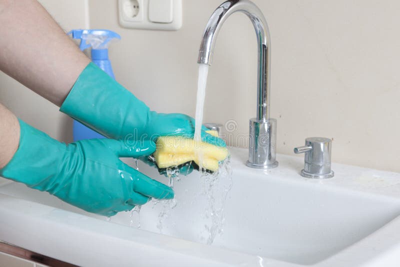 Sponge under faucet stock image. Image of housework, rubber - 51479239