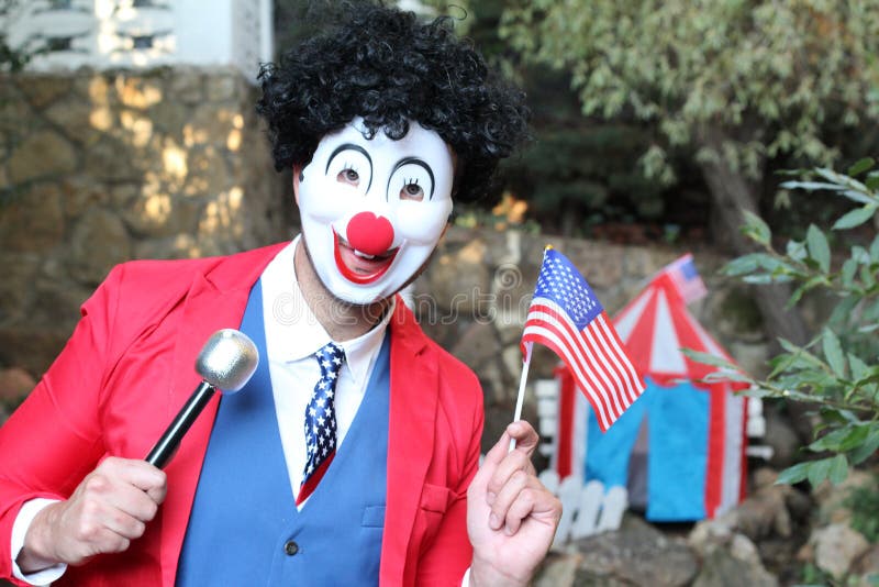 Spooky Clown Holding Flag and Dollar Sign Stock Photo - Image of ...