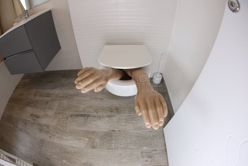 Spooky Arms Inside a Toilet Stock Photo - Image of gents, goodbye ...