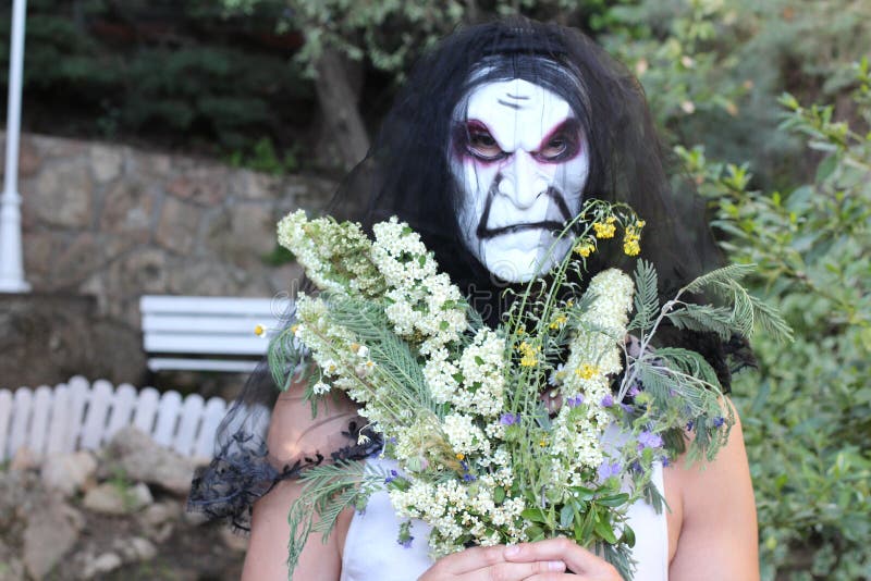 Spooky Bride Holding a Bouquet Stock Image - Image of mask, black ...