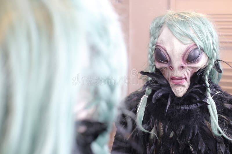 Spooky Female Alien Looking at Her Reflection Stock Photo - Image of ...