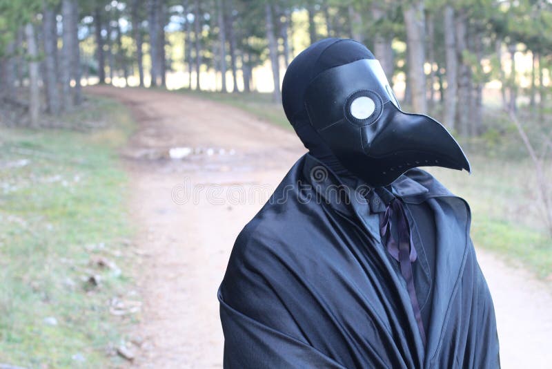 Spooky man with crow mask stock photo. Image of europe - 169169172