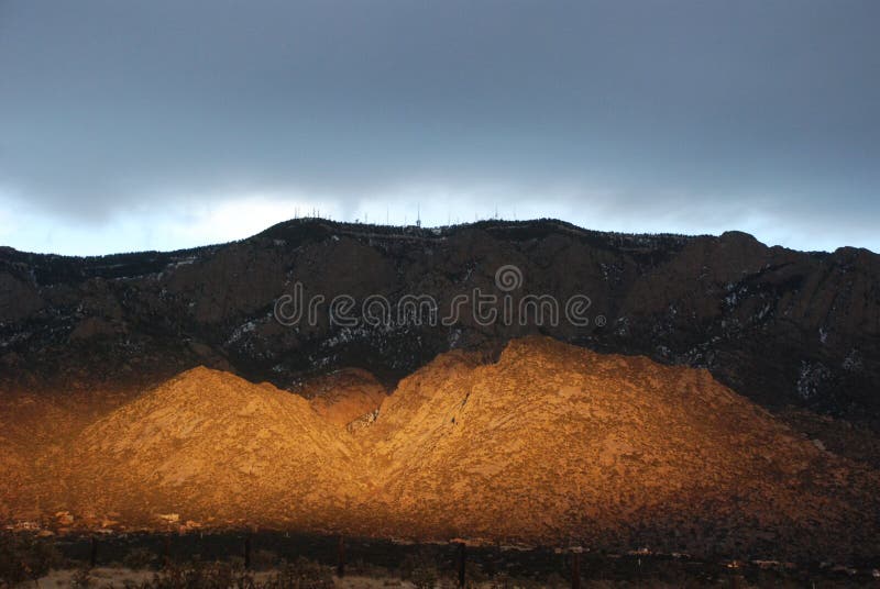 Spooky Sunlight at Sunset on the Sandia Mountains Stock Photo - Image ...