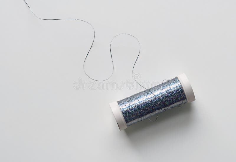 Spool of Blue Metallic Thread Stock Image - Image of color, unwound ...