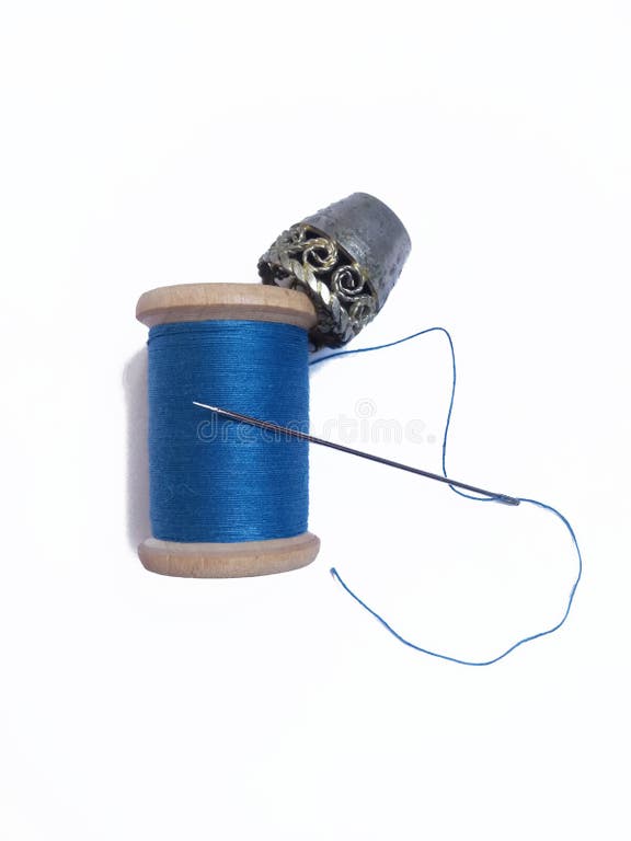 A Spool of Blue Thread, Thimble and Needle Stock Image - Image of ...