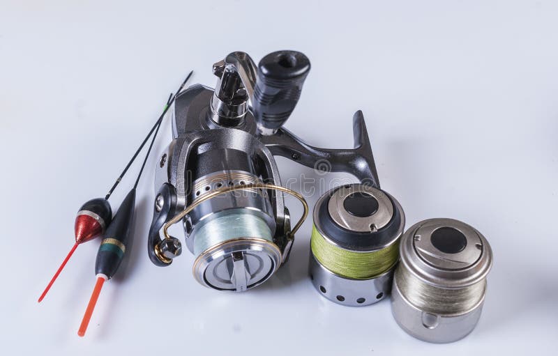 Spool of Fishing Line, Floats and a Box of Hooks Stock Photo - Image of ...