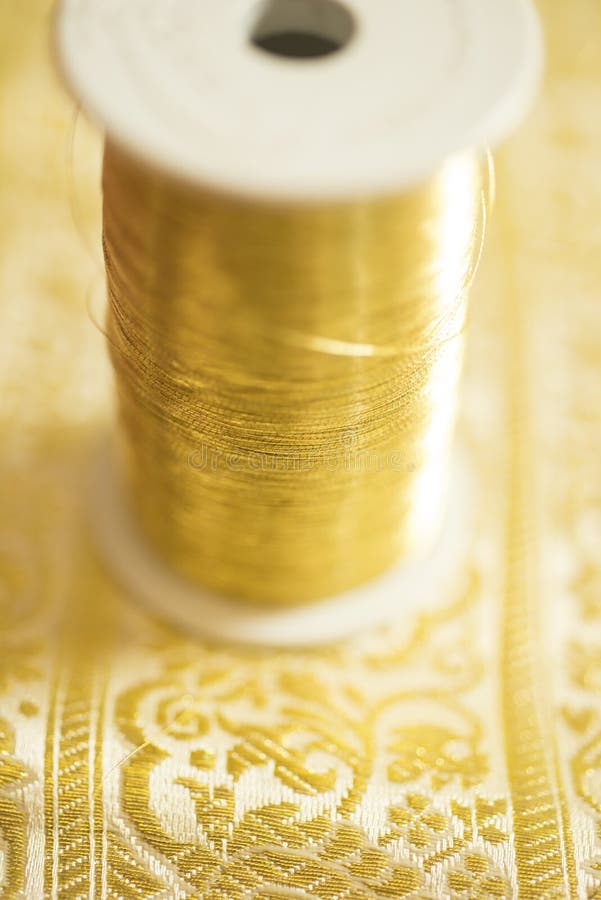Spool of Gold-Colored Thread Stock Photo - Image of rayon, string: 72940590