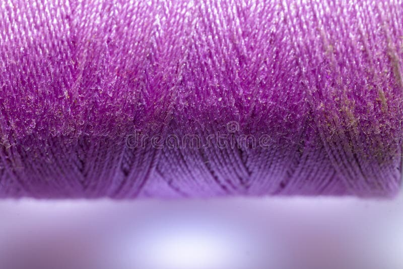 Spool of Purple Thread for Sewing with White Background Horizontally ...