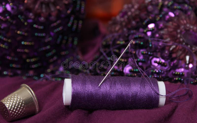 Spool of Purple Thread on Beaded Fabric Stock Image - Image of fashion ...