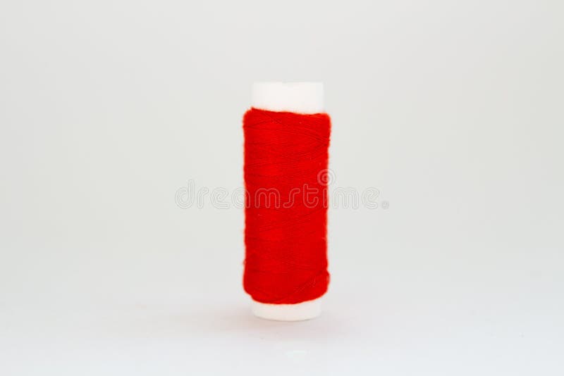 Spool of Red Thread on White Background Stock Photo - Image of colored ...