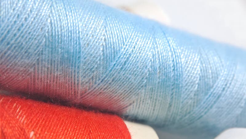 A Spool of Thread with Blue and Red Colors Stock Image - Image of organ ...