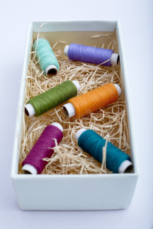 Spool of thread in the box stock photo. Image of needlework - 141064746