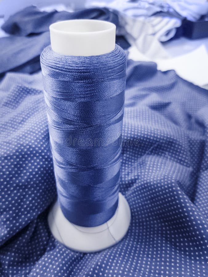 A Spool of Thread for Embroidery in the Color of the Fabric As a ...