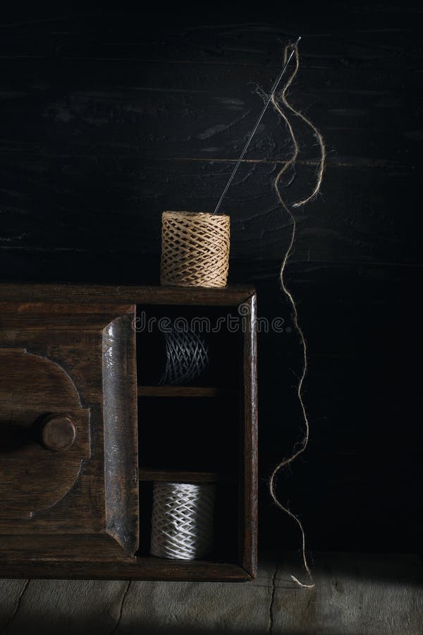 Spool of Thread and Needle on an Old Vintage Box Stock Image - Image of ...