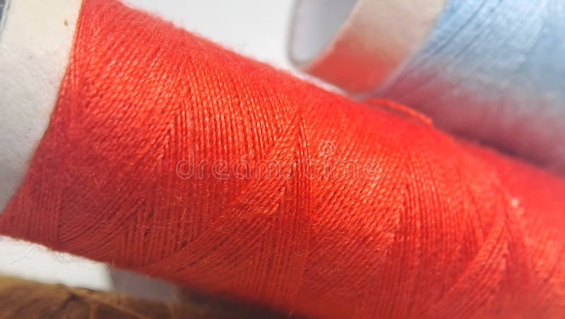 A Spool of Thread with Red and Blue Colors Stock Image - Image of ...