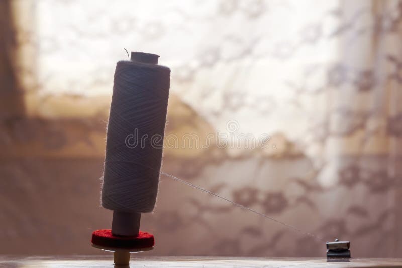 A Spool of Thread on a Sewing Machine Handmade Stock Photo - Image of ...