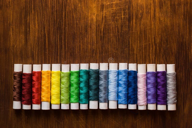 Spool of Thread of Various Colors on the Wooden Desk Stock Image ...