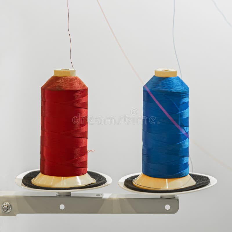 Close-up of Two Spools of Red and Blue Thread for Sewing Textiles ...