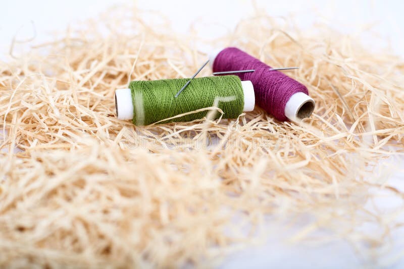 Spool of Two Thread with Needle Stock Photo - Image of fabric, bobbin ...