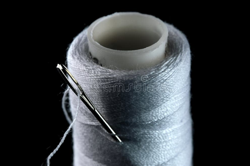 A Spool of White Thread and a Needle Stock Photo - Image of object ...