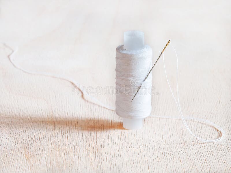 Spool with White Thread and with a Needle Stock Image - Image of wood ...