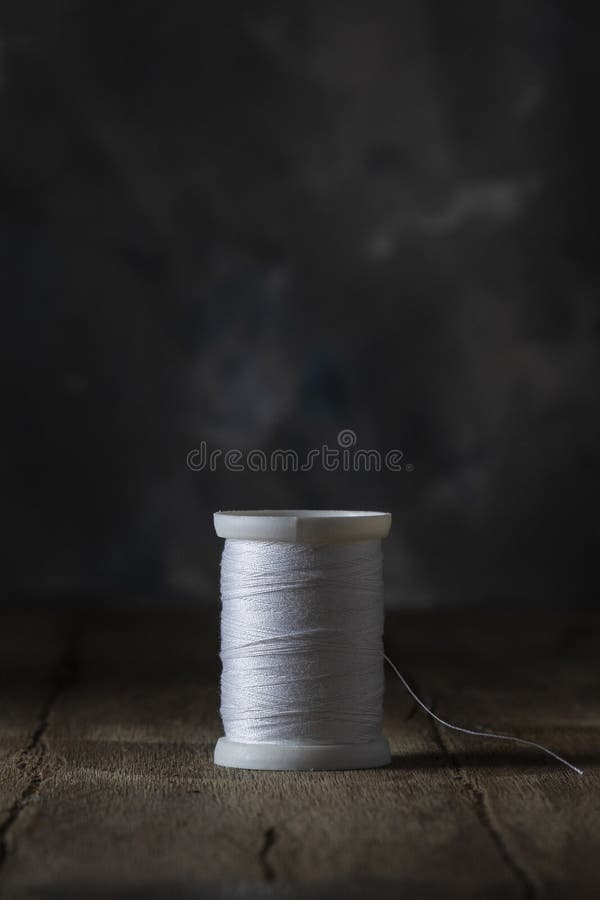 Spool of White Thread on a Wooden Table Stock Image - Image of wood ...